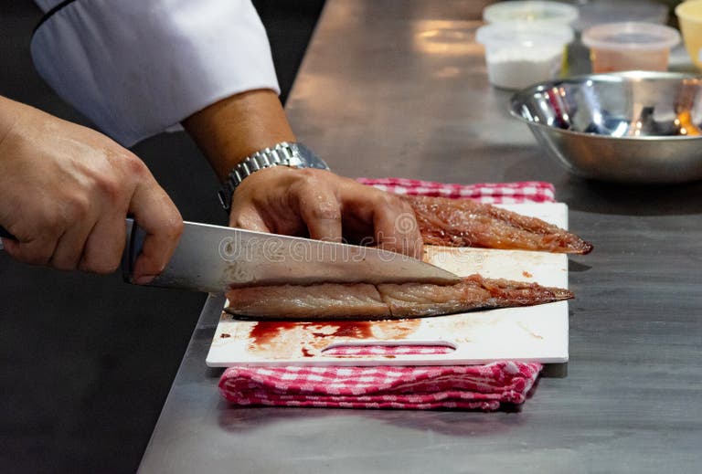Chef Cutting Fish, Chef Slices Fish Fresh on Board in the Kitchen Stock ...