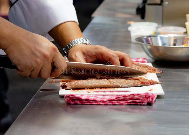 Chef Cutting Fish, Chef Slices Fish Fresh on Board in the Kitchen Stock ...