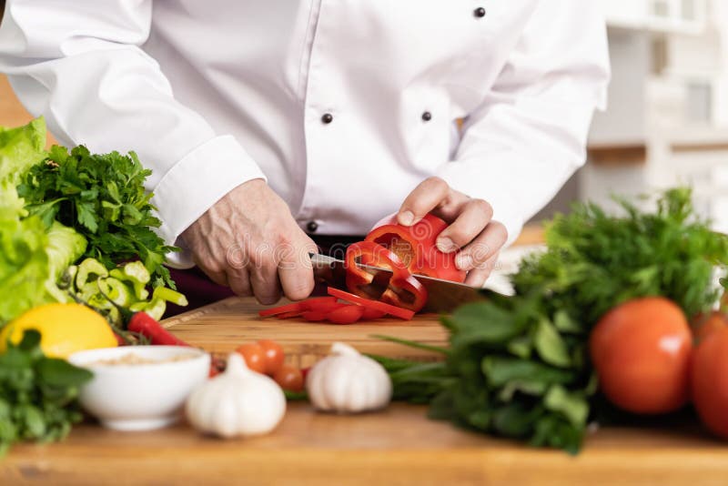 Chef Cutting Fresh and Delicious Vegetables for Cooking. Stock Photo ...