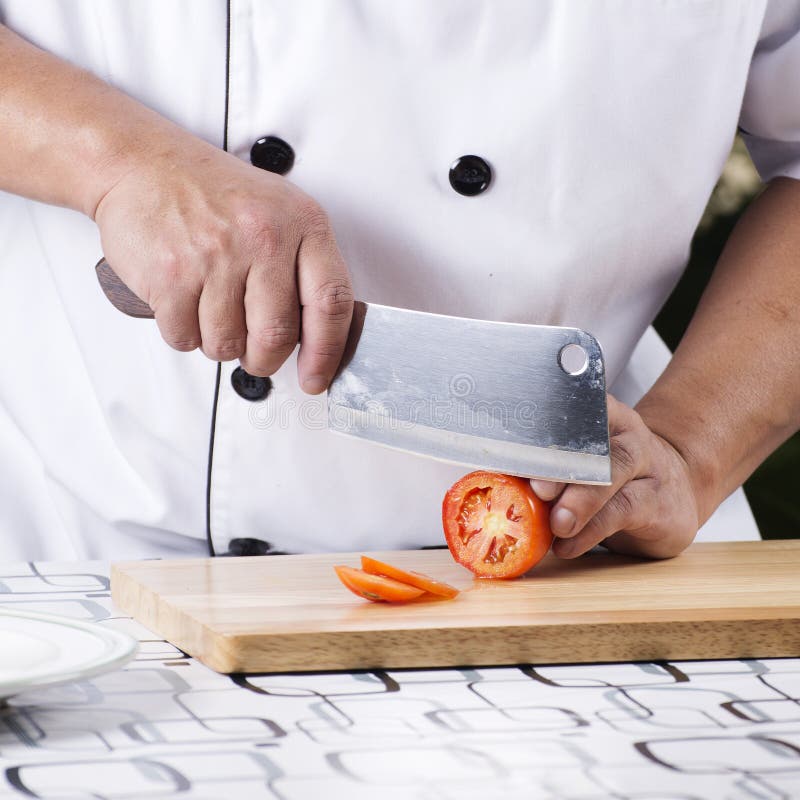 Chef cutting fresh tomato stock photo. Image of organic - 62327404