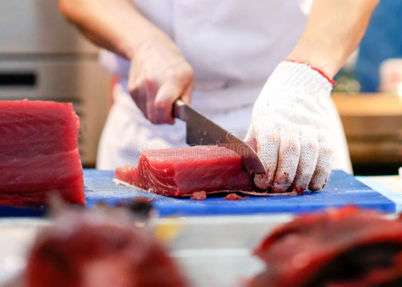 Chef Cutting Fresh Tuna Fish in the Kitchen Stock Photo - Image of ...