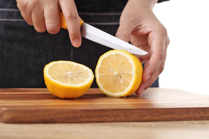 Cutting a lemon stock image. Image of fruit, cutting - 81748645