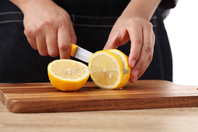 Cutting a lemon stock image. Image of fruit, cutting - 81748645