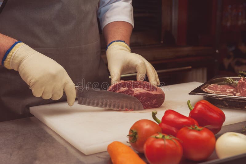 Chef cutting meat stock photo. Image of meat, fresh, nutrition - 76246602