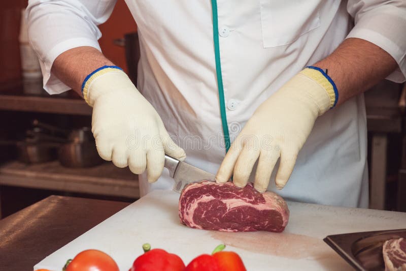 Chef cutting meat stock photo. Image of hotel, hands - 89327650