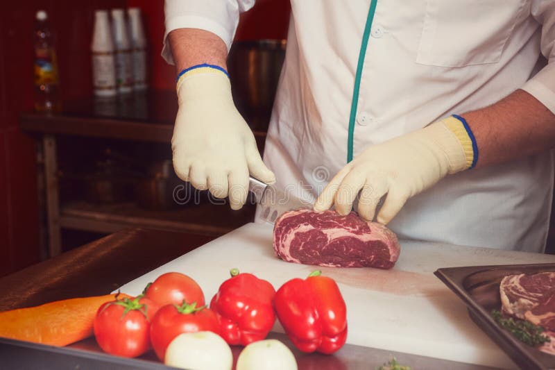 Chef cutting meat stock image. Image of caucasian, meat - 93568535