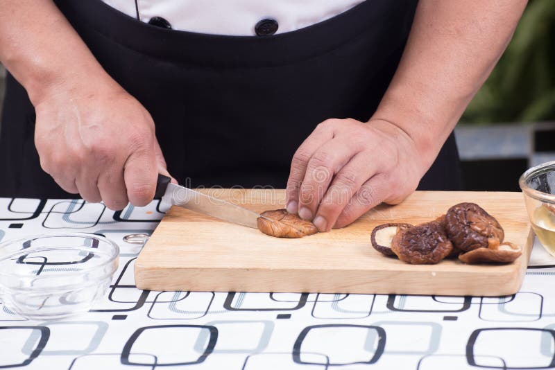 Chef is cutting mushroom stock photo. Image of broccoli - 77549476