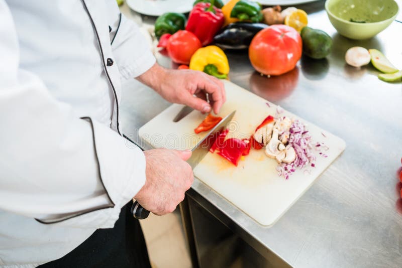 Chef Cutting Vegetables in His Restaurant Kitchen Stock Image - Image ...