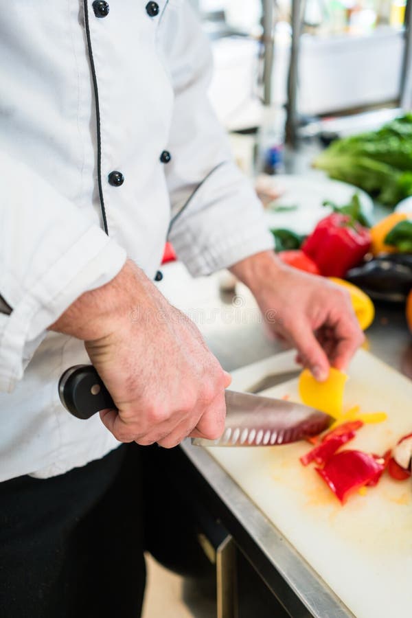 Chef Cutting Vegetables in His Restaurant Kitchen Stock Image - Image ...
