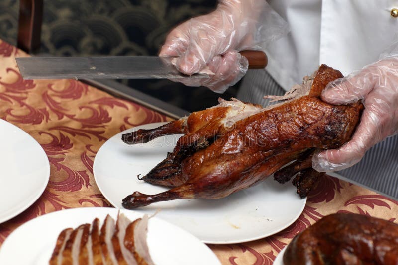 Chef cutting peking duck stock image. Image of culture - 39121137