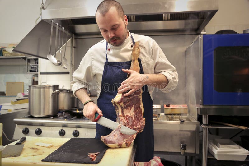 Chef Cutting a Piece of Meat Stock Image - Image of gammon, chef: 39517315