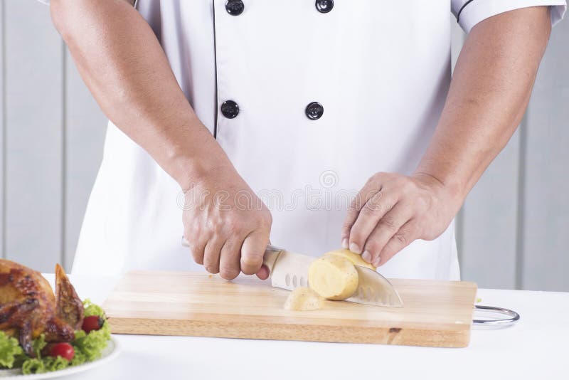 Chef cutting potato stock photo. Image of working, cooking - 47624858