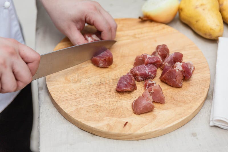 Chef Cutting Raw Meat on the Wood Block Stock Image - Image of dice ...