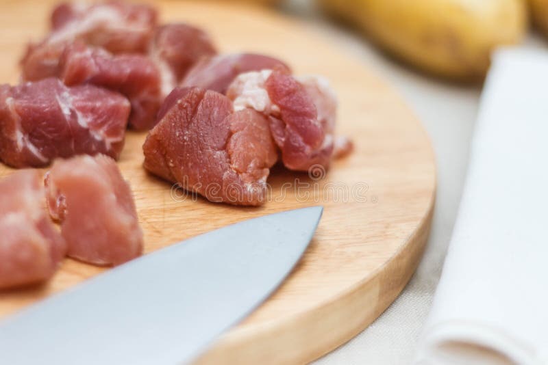 Chef Cutting Raw Meat on the Wood Block Stock Photo - Image of neck ...