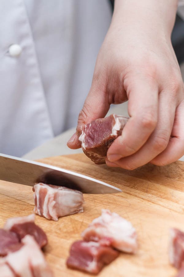 Chef Cutting Raw Meat on the Wood Block Stock Image - Image of dice ...