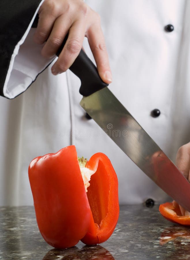Chef Cutting Red Pepper stock image. Image of dinner - 10653903
