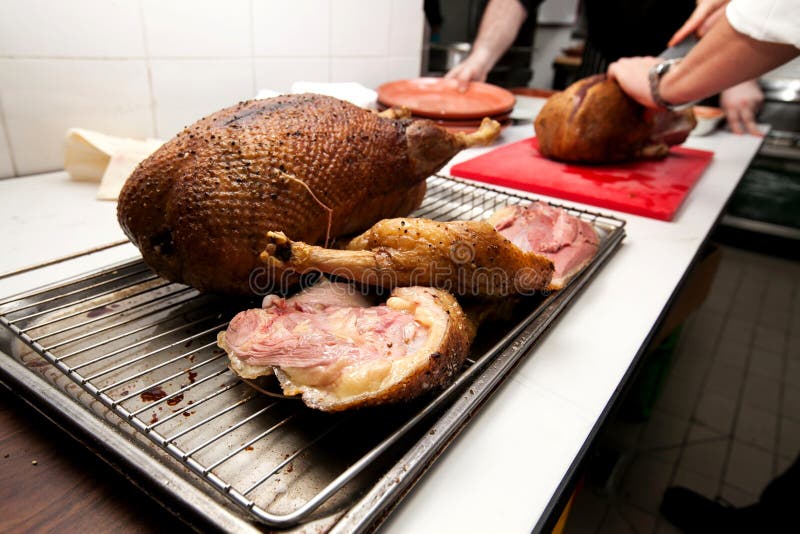 Chef Cutting Roast Goose in Restaurant Kitchen for Cooking Stock Image ...