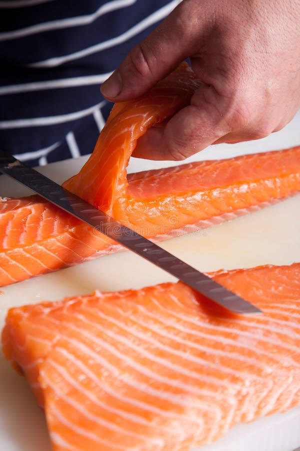 Chef cutting salmon fish stock image. Image of hands - 16939097