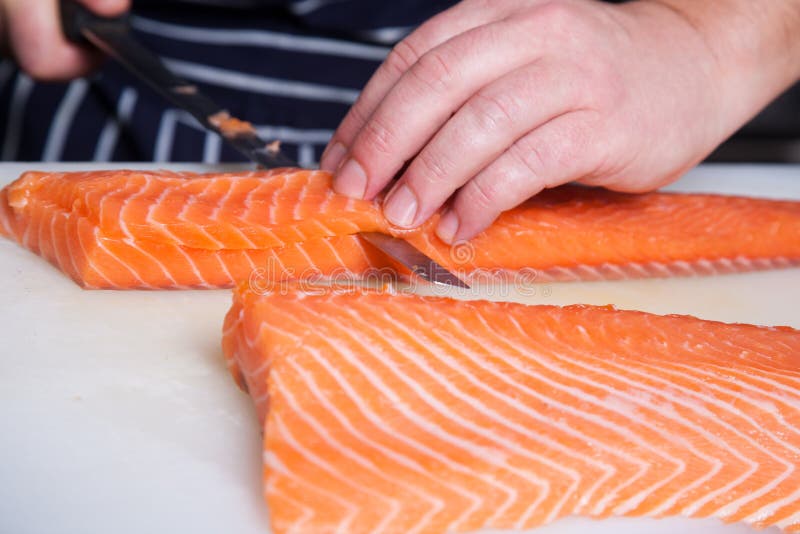 Chef cutting salmon fish stock image. Image of food, chef - 16939101