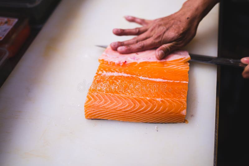 Chef Cutting Salmon Fish on Cutting Board Stock Photo - Image of orange ...