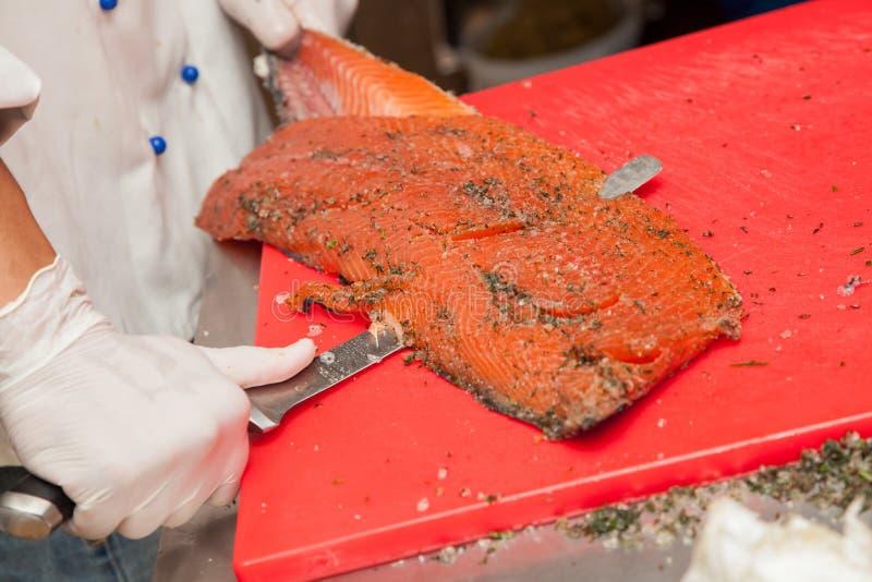Chef Cutting salmon fish stock image. Image of cutting - 49992889