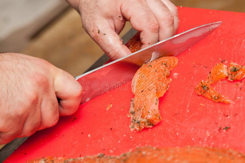 Chef Cutting salmon fish stock photo. Image of freshness - 49993266