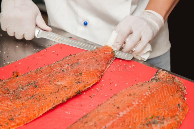 Chef Cutting salmon fish stock image. Image of prepared - 49993655