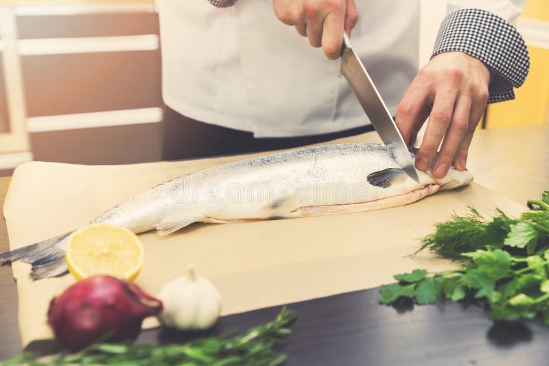 Chef Cutting Salmon Fish at Restaurant Kitchen Stock Photo - Image of ...