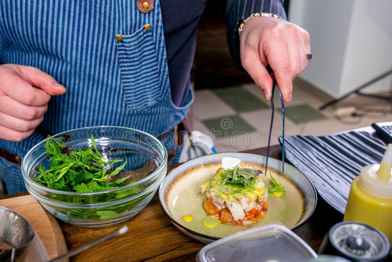 Chef Decorates the Dish from Pickled Cod. Master Class in the Kitchen ...