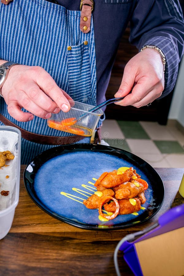 Chef Decorates The Dish From Smoked Catfish Head In Batter. Master ...
