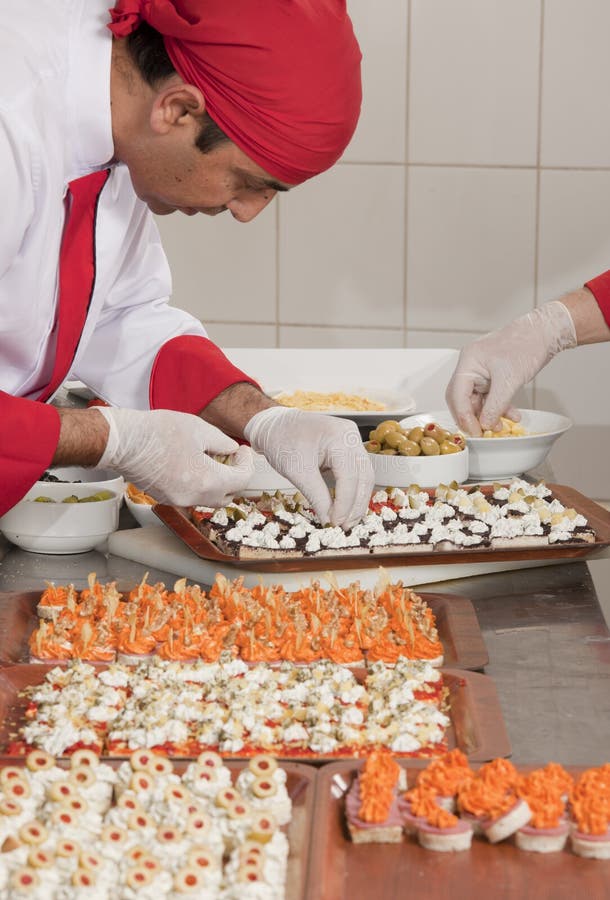 Chef Decorating canapes stock image. Image of canape - 25011281