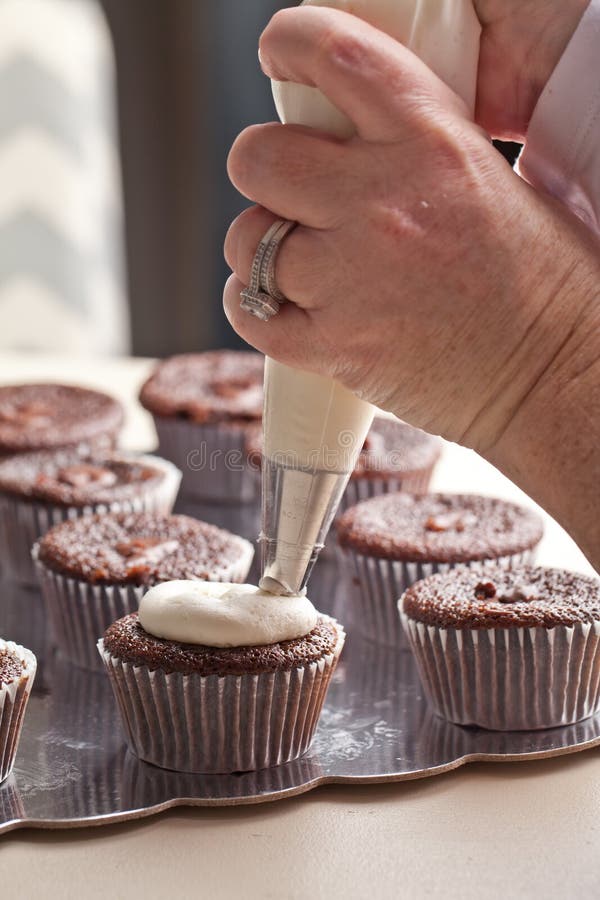 Chef Decorating Chocolate Cupcakes - Hands Stock Photo - Image of ...