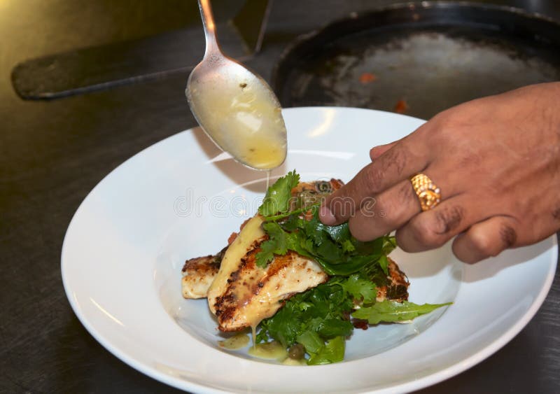 Chef is decorating dish stock photo. Image of cooking - 11501068