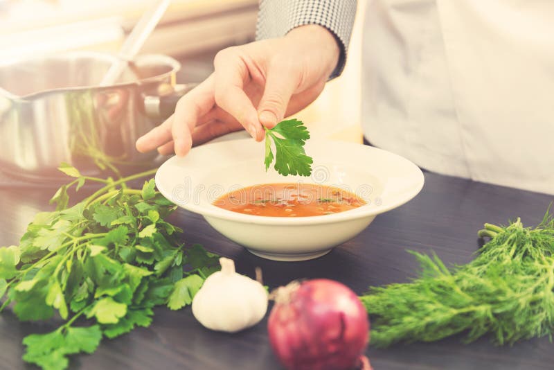 Chef Decorating Soup with Herbs Stock Photo - Image of dill, garlic ...