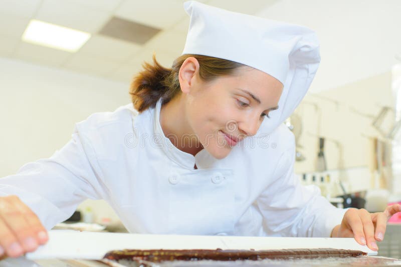 Chef dividing a cake stock image. Image of specialty - 124017841