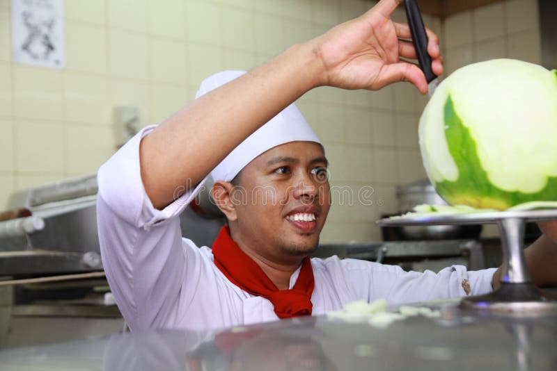 Chef doing carving stock photo. Image of employee, food - 12958216