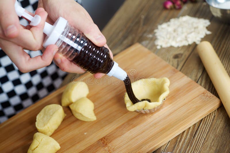 Chef Filling Dough Form with Chocolate Stock Image - Image of bakery ...