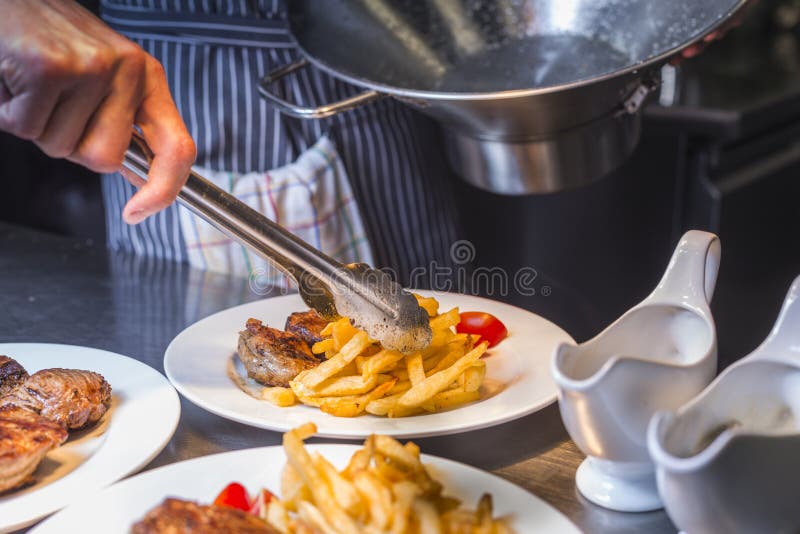 Chef Finishing Her Plate and almost Ready To Serve Stock Image - Image ...