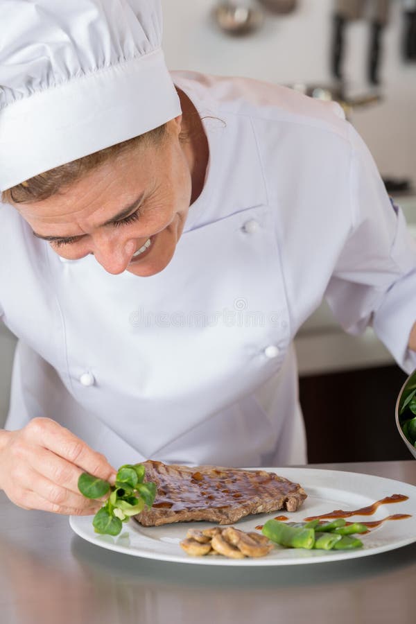 Chef finishing your plate stock photo. Image of salad - 66257916