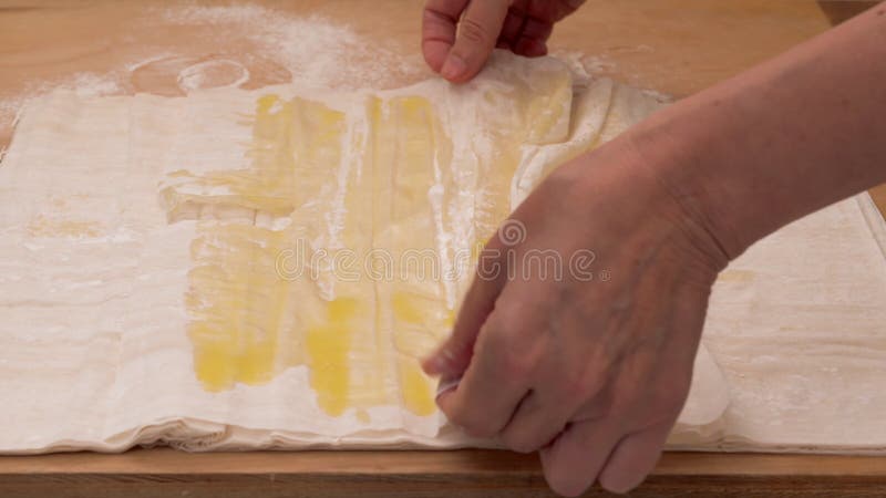 Chef Folding Buttered Layers of Phyllo Dough into Rolls Stock Video ...