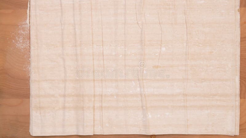 Chef Folding Buttered Layers of Phyllo Dough into Rolls Stock Video ...