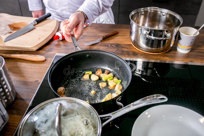 Chef Fry Garlic in a Pan. Master Class in the Kitchen. the Process of ...