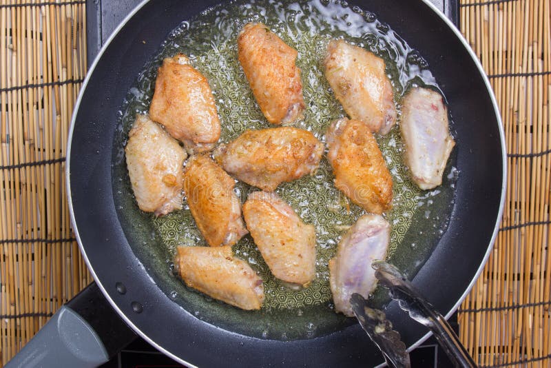 Chef Frying Chicken Wings in Pan Stock Photo - Image of kitchen, crispy ...