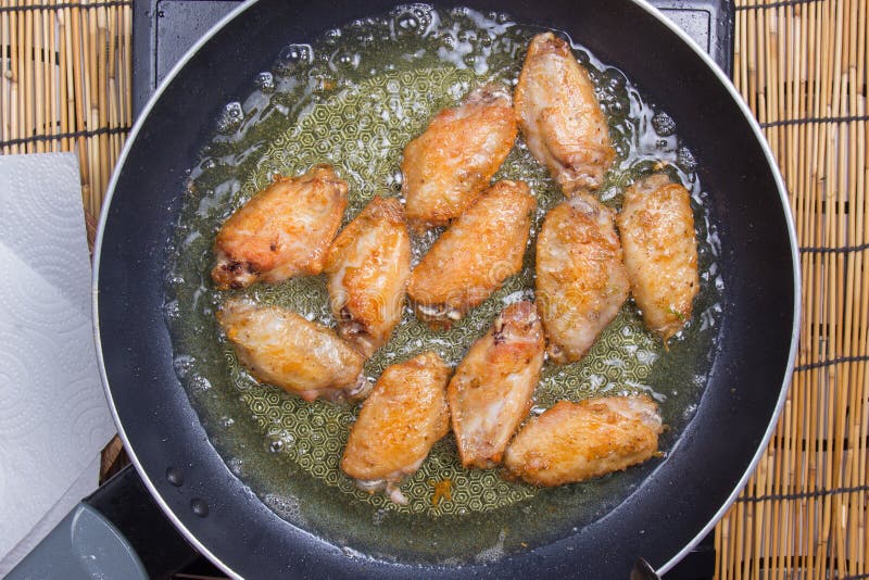 Chef Frying Chicken Wings in Pan Stock Photo - Image of golden ...