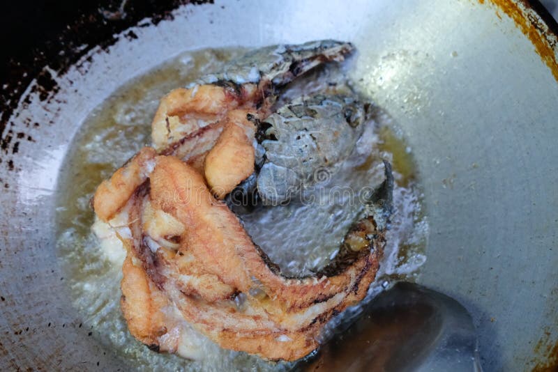 The Chef Frying Fish in a Chinese Restaurant Stock Photo - Image of ...