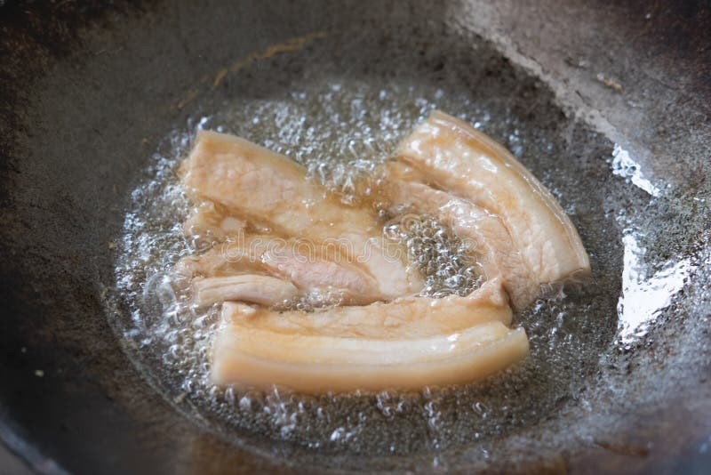 Chef frying meat in a pan stock photo. Image of meat - 83392396