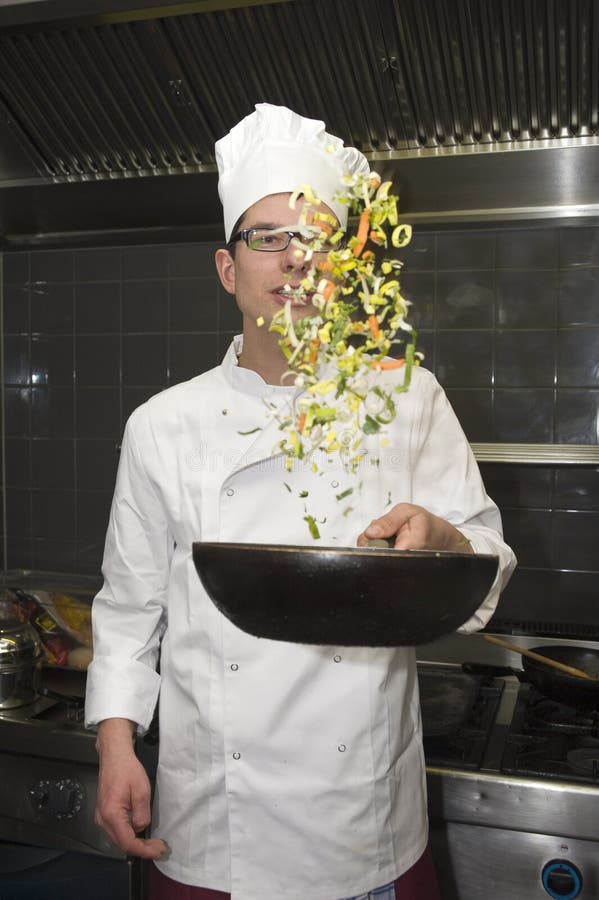 Chef frying vegetables stock image. Image of pots, dinner - 13140845