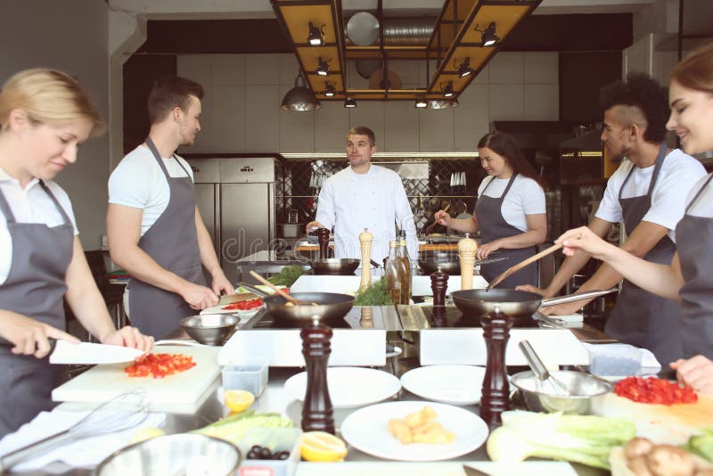 Chef and Group of Young People during Cooking Classes Stock Photo ...
