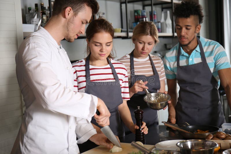 Chef and Group of Young People during Cooking Classes Stock Photo ...