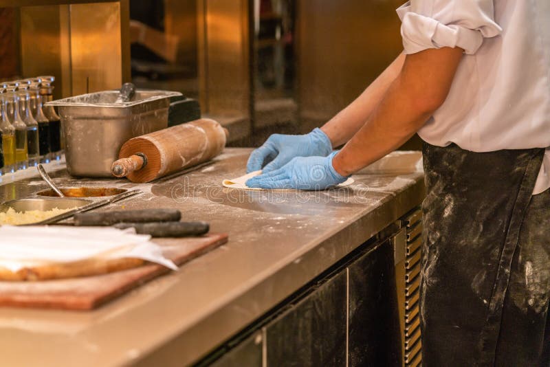 Chef Making Italian Pizza in the Kitchen Restaurant Stock Image - Image ...